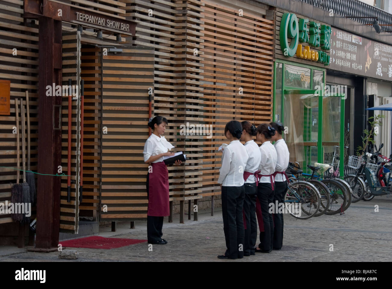 Manager instructing employees outside beijing hi-res stock photography ...