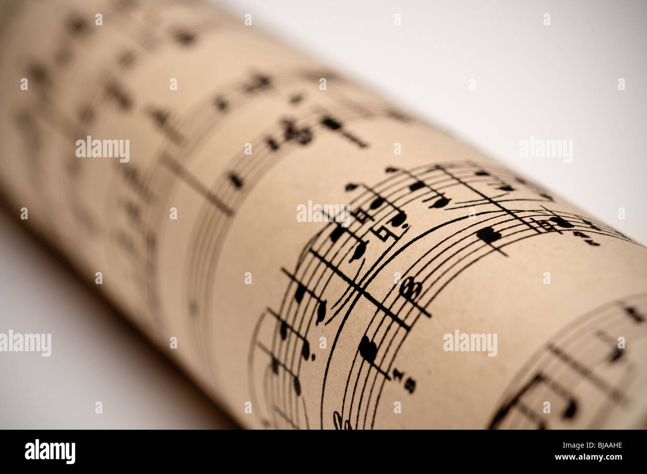a roll of sheet music on old discolored parchment Stock Photo - Alamy