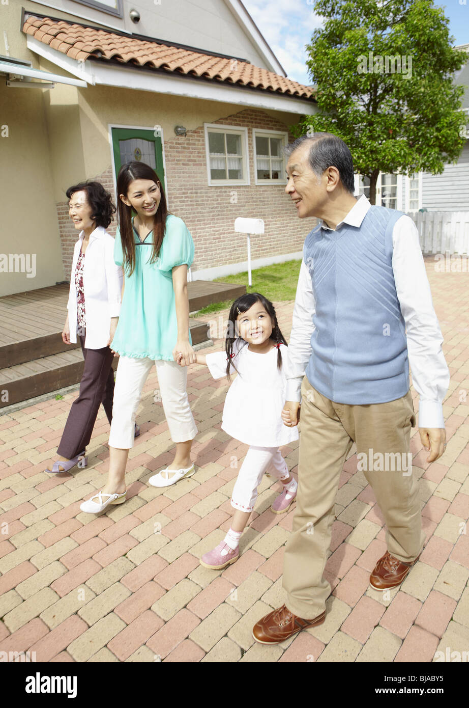 Three-generation family walking around Stock Photo - Alamy