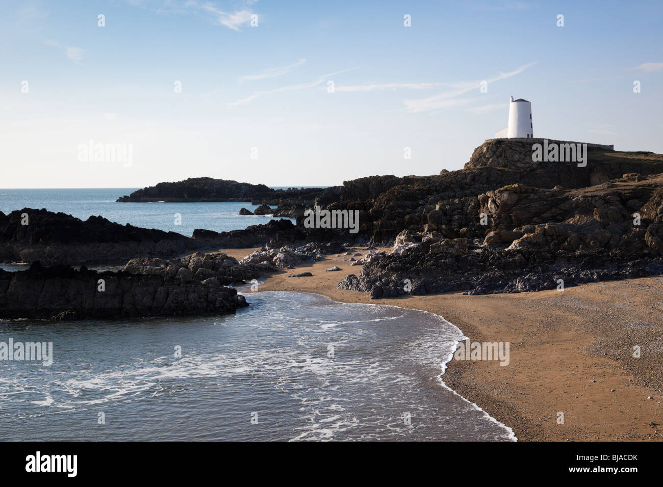 Newborough Anglesey North Wales UK. View across beach to old lighthouse ...