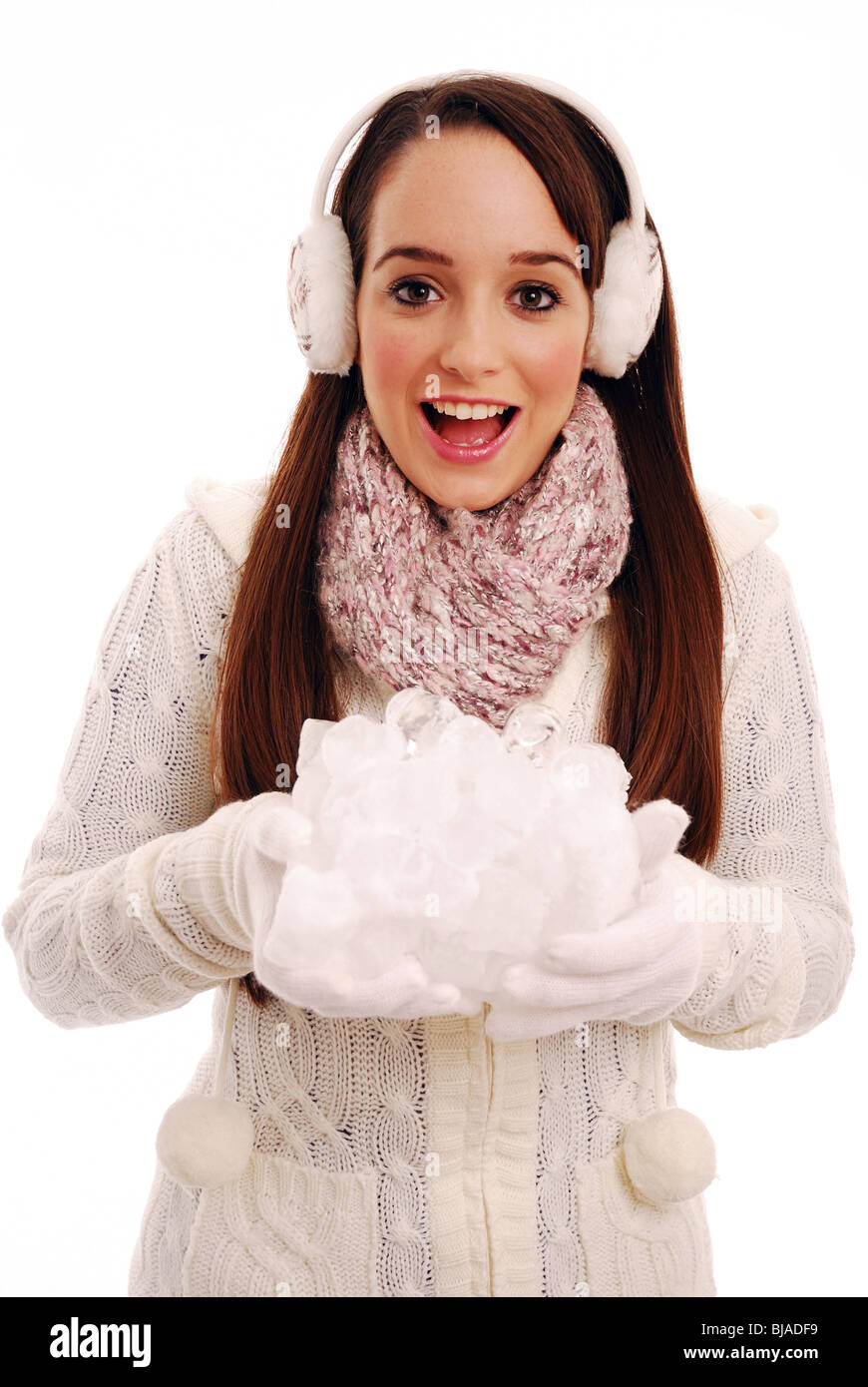 Young girl wrapped up warm holding a block of snow Stock Photo - Alamy