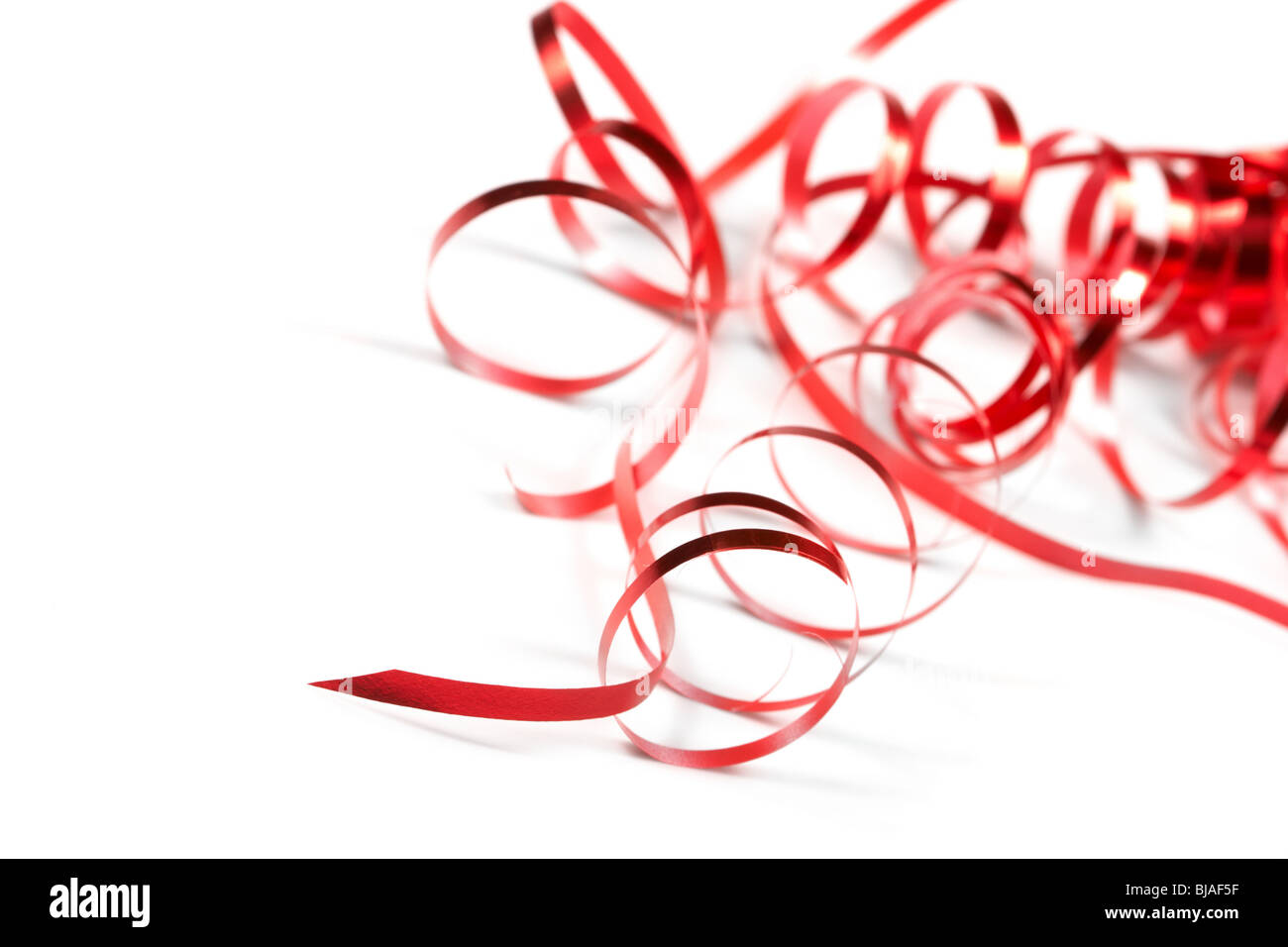 Red ribbon on white background Stock Photo - Alamy