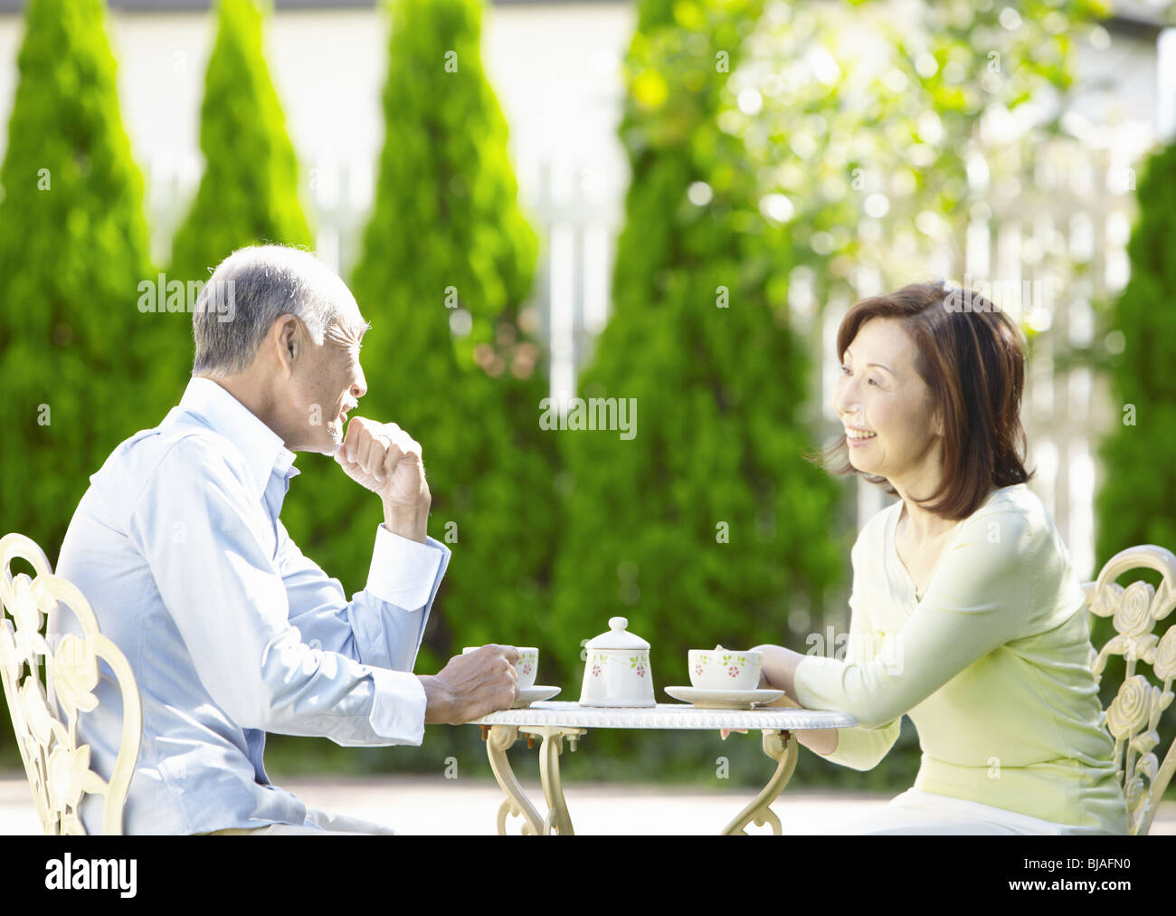 Couple having teatime Stock Photo - Alamy