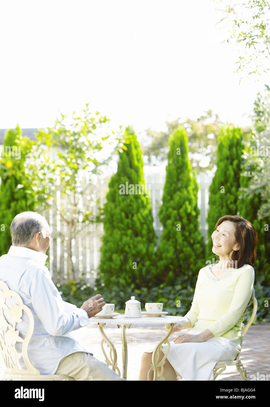 Couple having teatime Stock Photo - Alamy