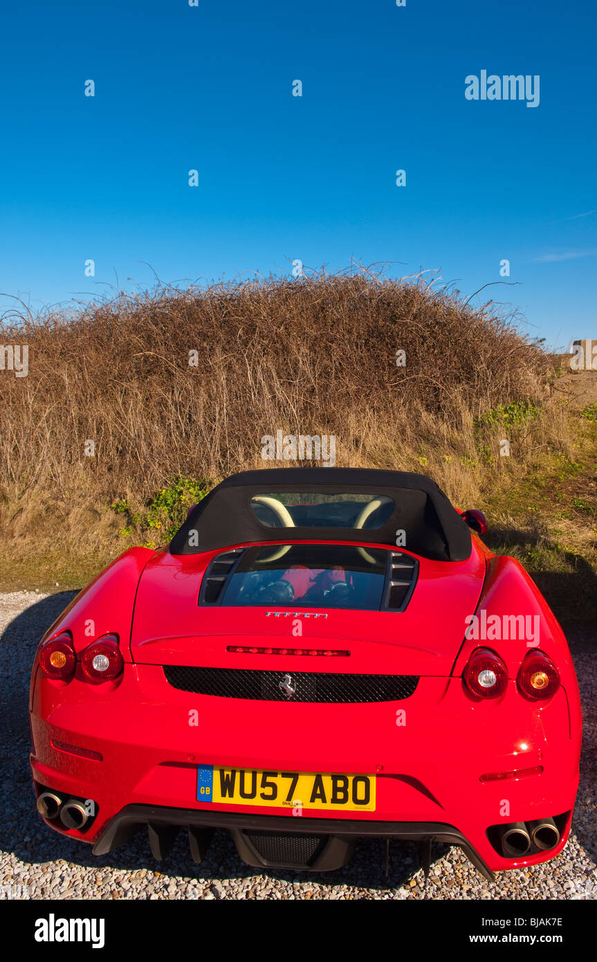 The rear of a red Ferrari supercar in the Uk Stock Photo - Alamy