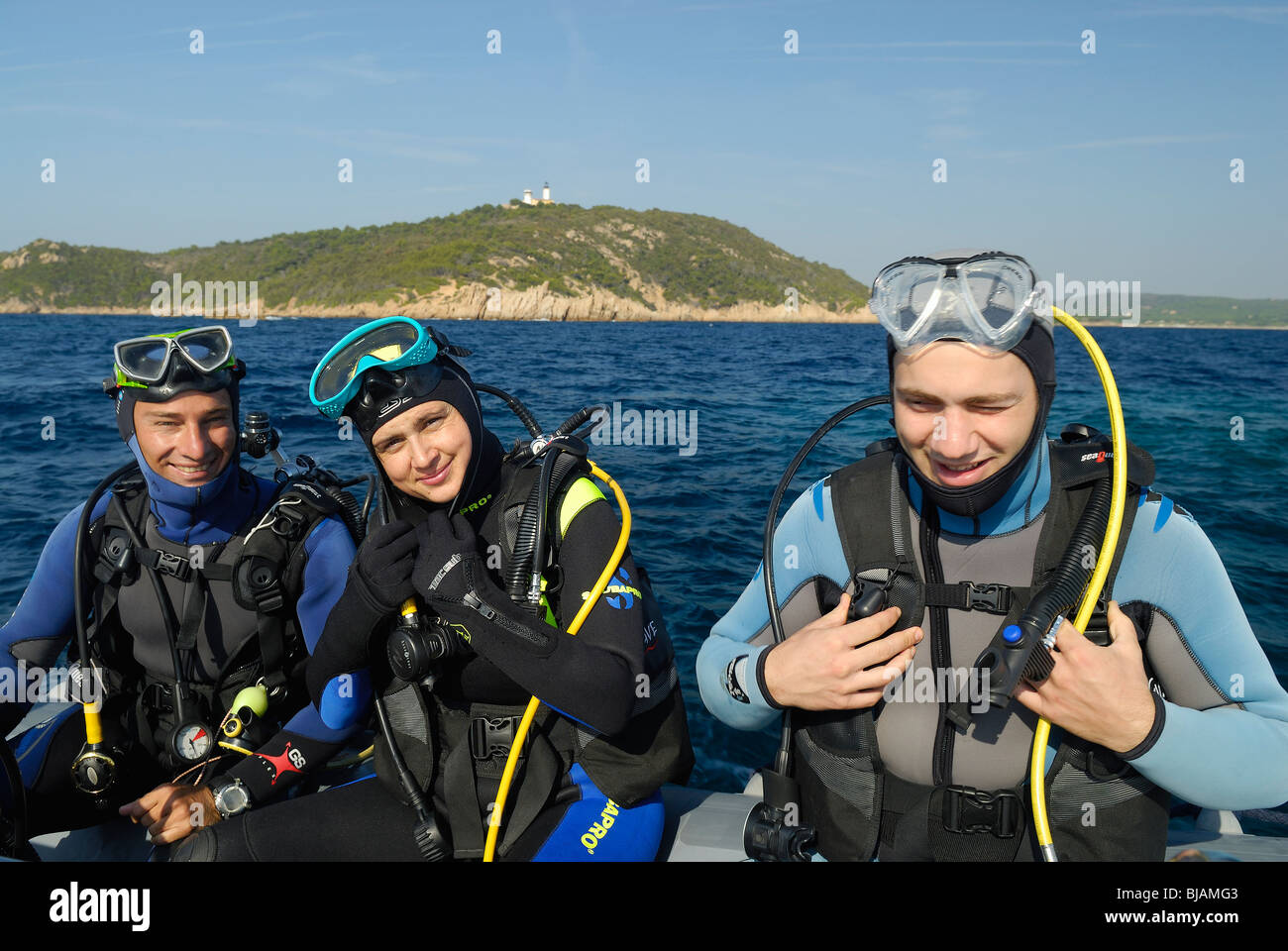 Three divers ready to dive in the Mediterranean Sea Stock Photo - Alamy