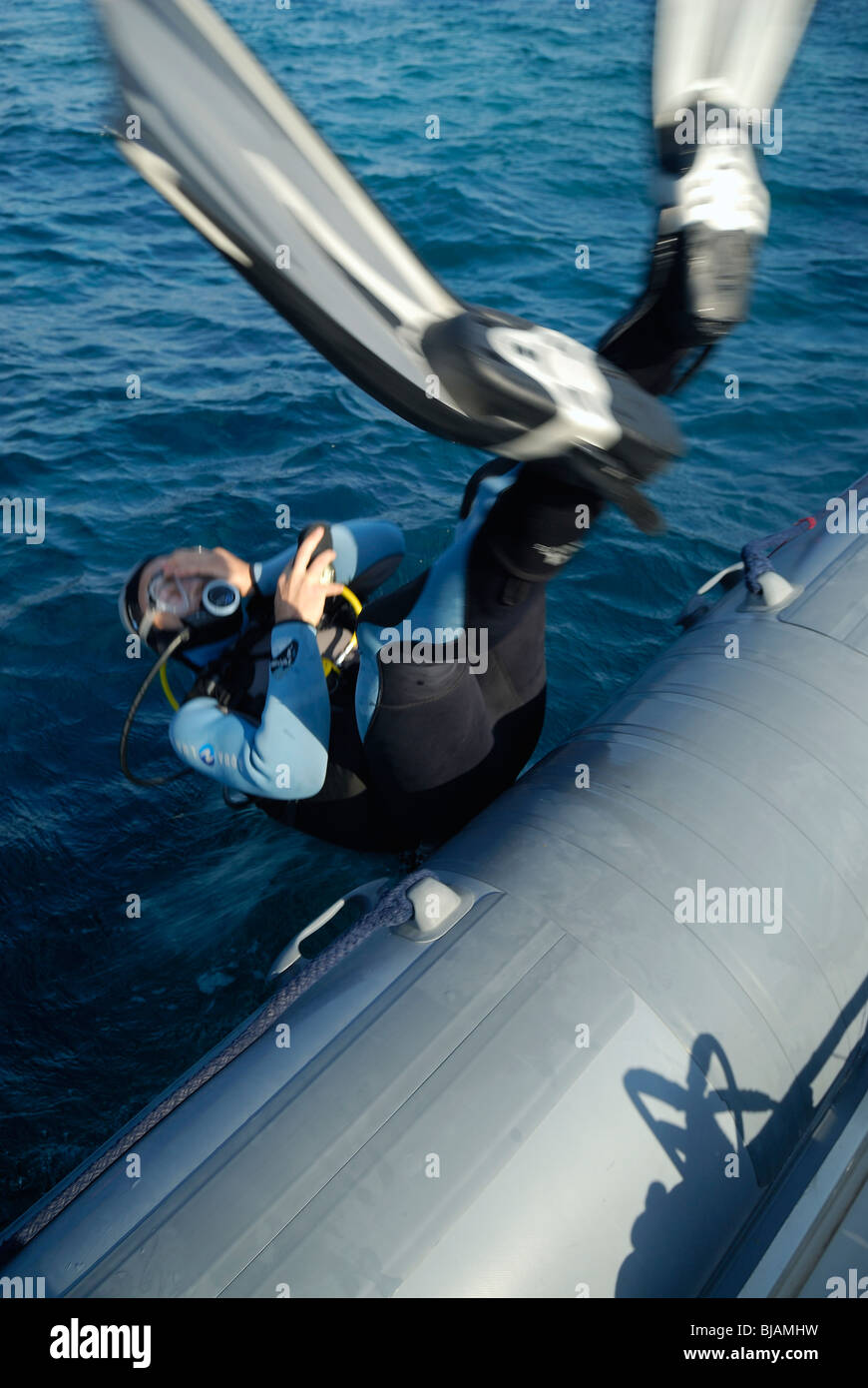 Scuba diver rolling back to dive in the Mediterranean Sea Stock Photo ...