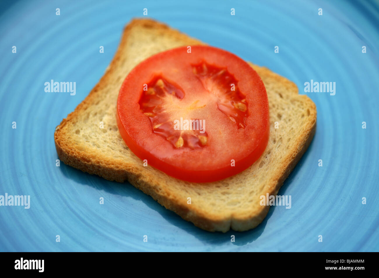 Melba Toast and Tomato Stock Photo - Alamy