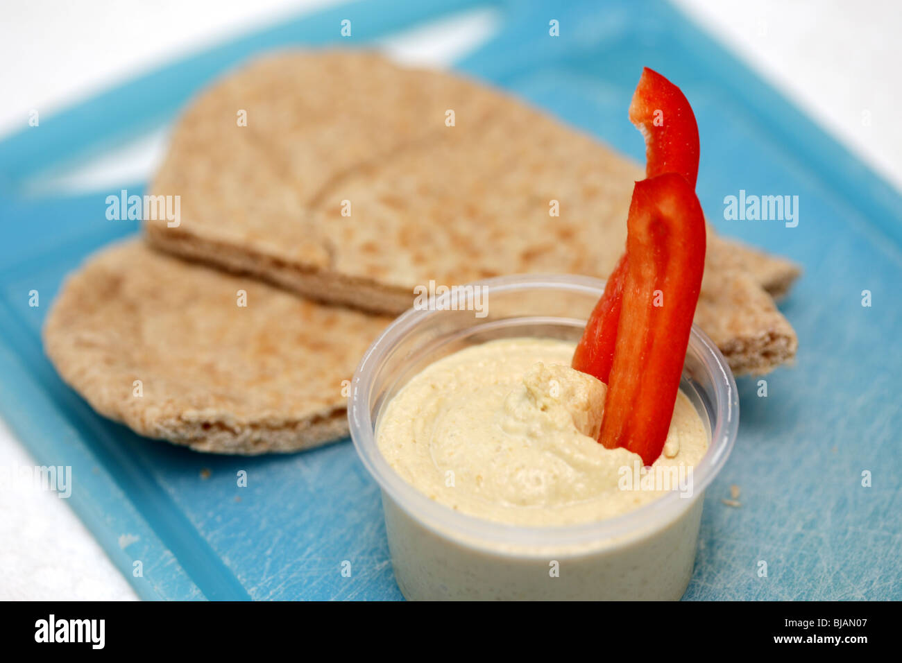 Hummus with Red Peppers and Pitta Bread Stock Photo - Alamy