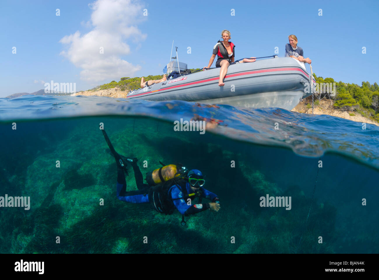 Diver under a boat in the Mediterranean Sea, off Saint Tropez Stock ...
