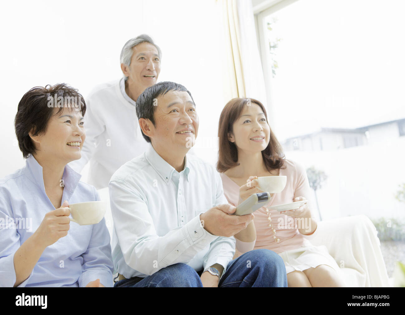 Senior group watching TV Stock Photo - Alamy