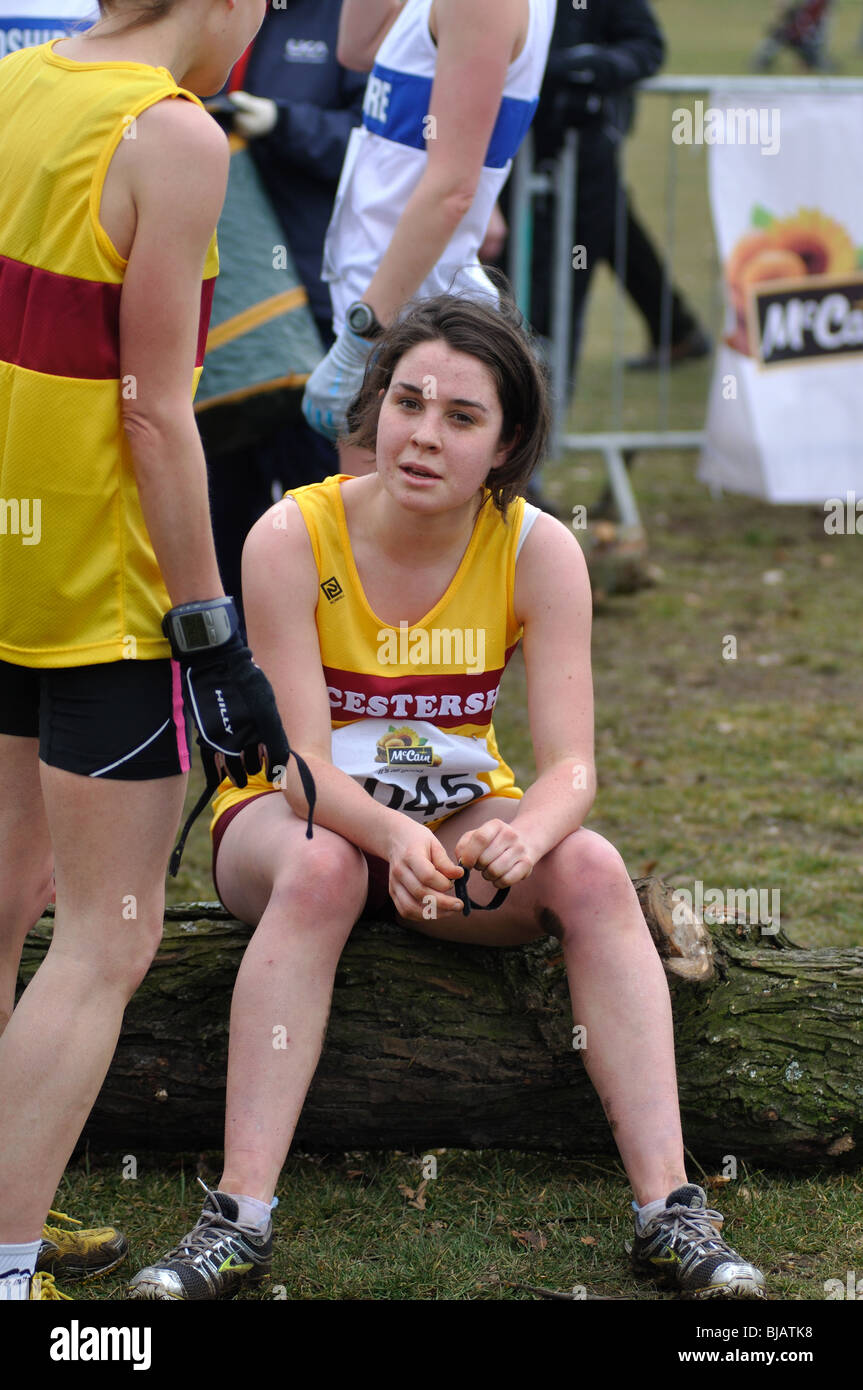 Woman runner sitting down after cross-country race at Cofton Park ...