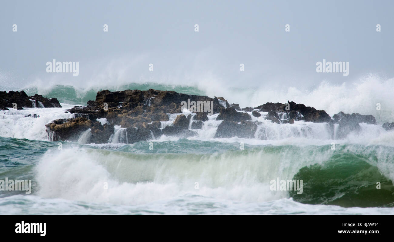 Waves break over Rock in the ocean Stock Photo - Alamy