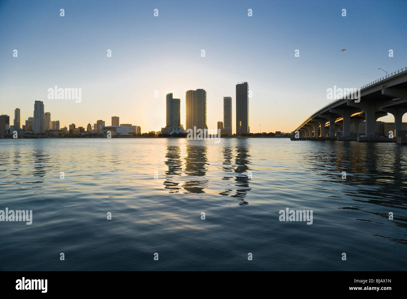Miami skyline looking at the MacArthur Causeway at sunset Stock Photo ...