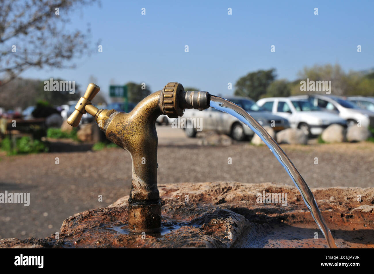 Running tap wasting water Stock Photo - Alamy
