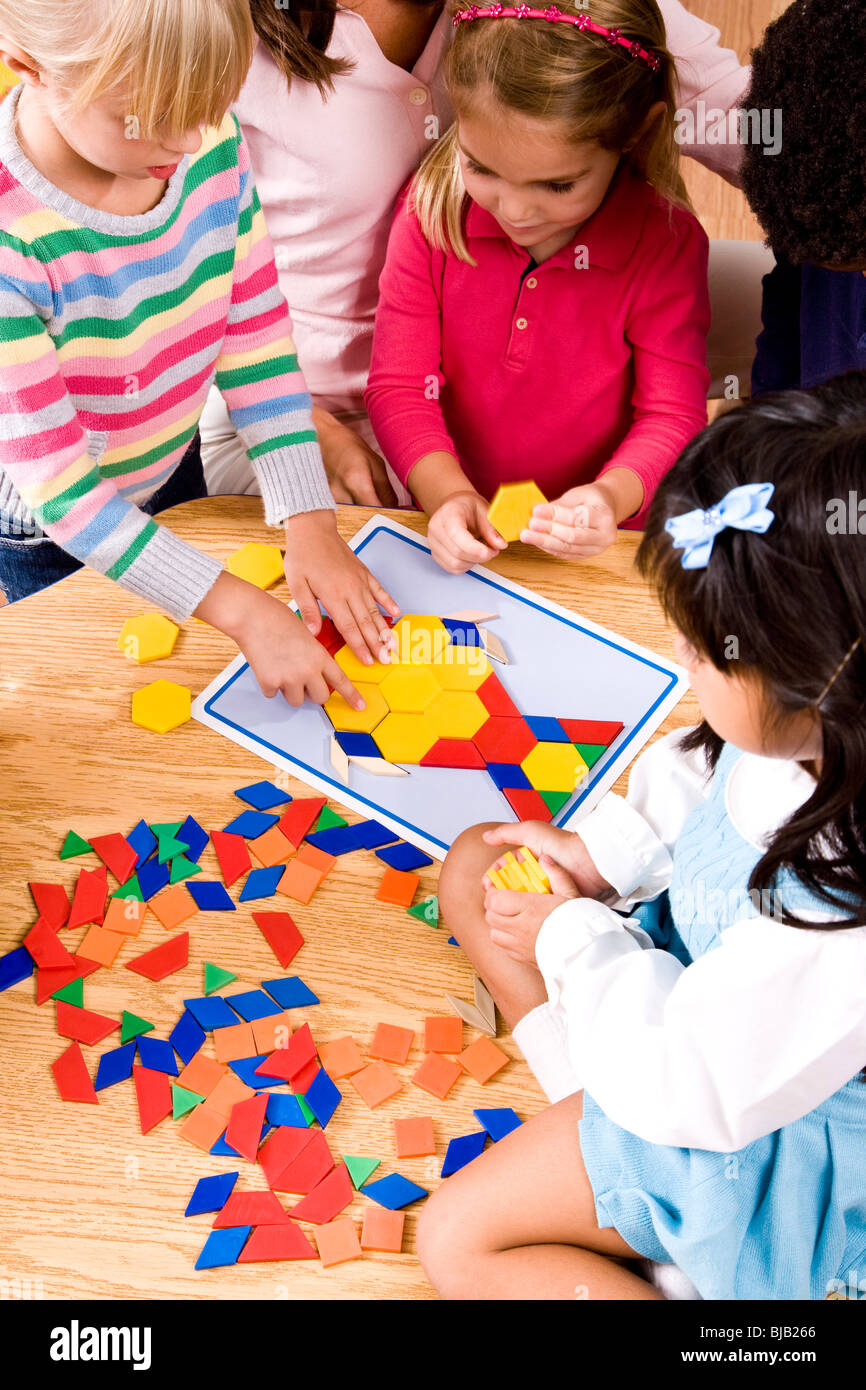 Group of children in preschool learning shapes and colors Stock Photo ...