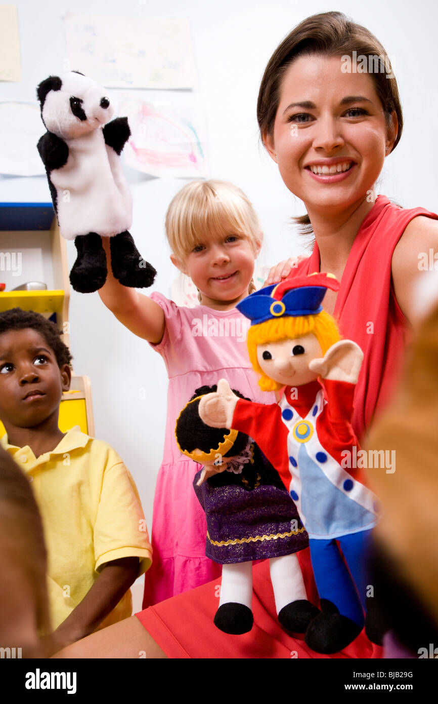Teacher preschool children playing puppets hi-res stock photography and ...