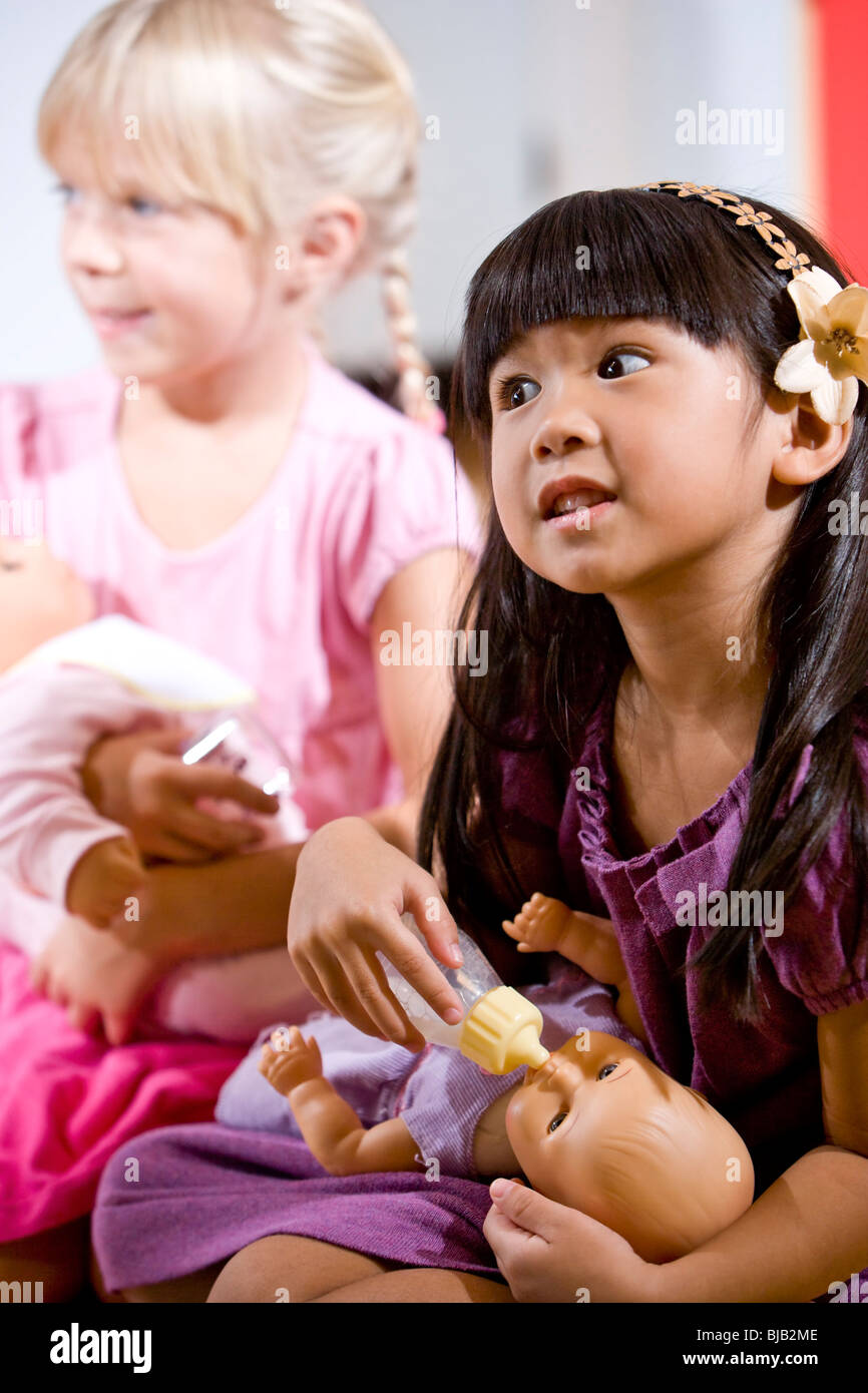 Girls watching dolls hi-res stock photography and images - Alamy