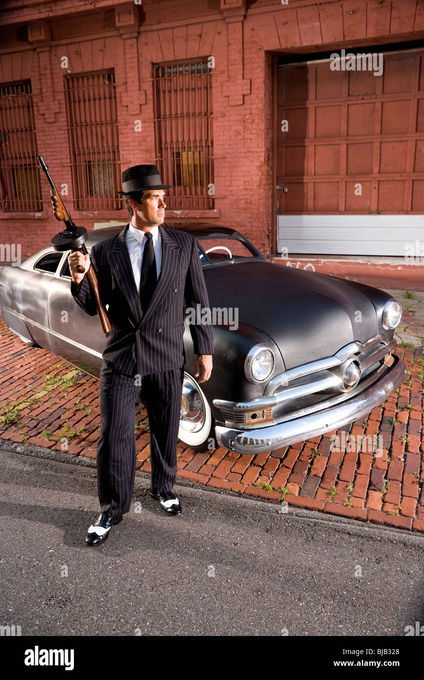 Gangster holding tommy gun standing hi-res stock photography and images ...