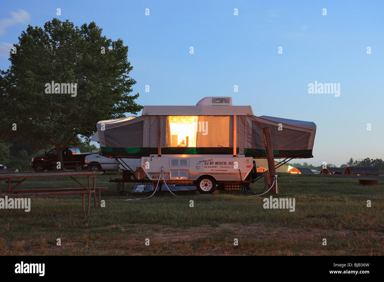 A small iluminated caravan on a campsite, Grand Island, United States ...