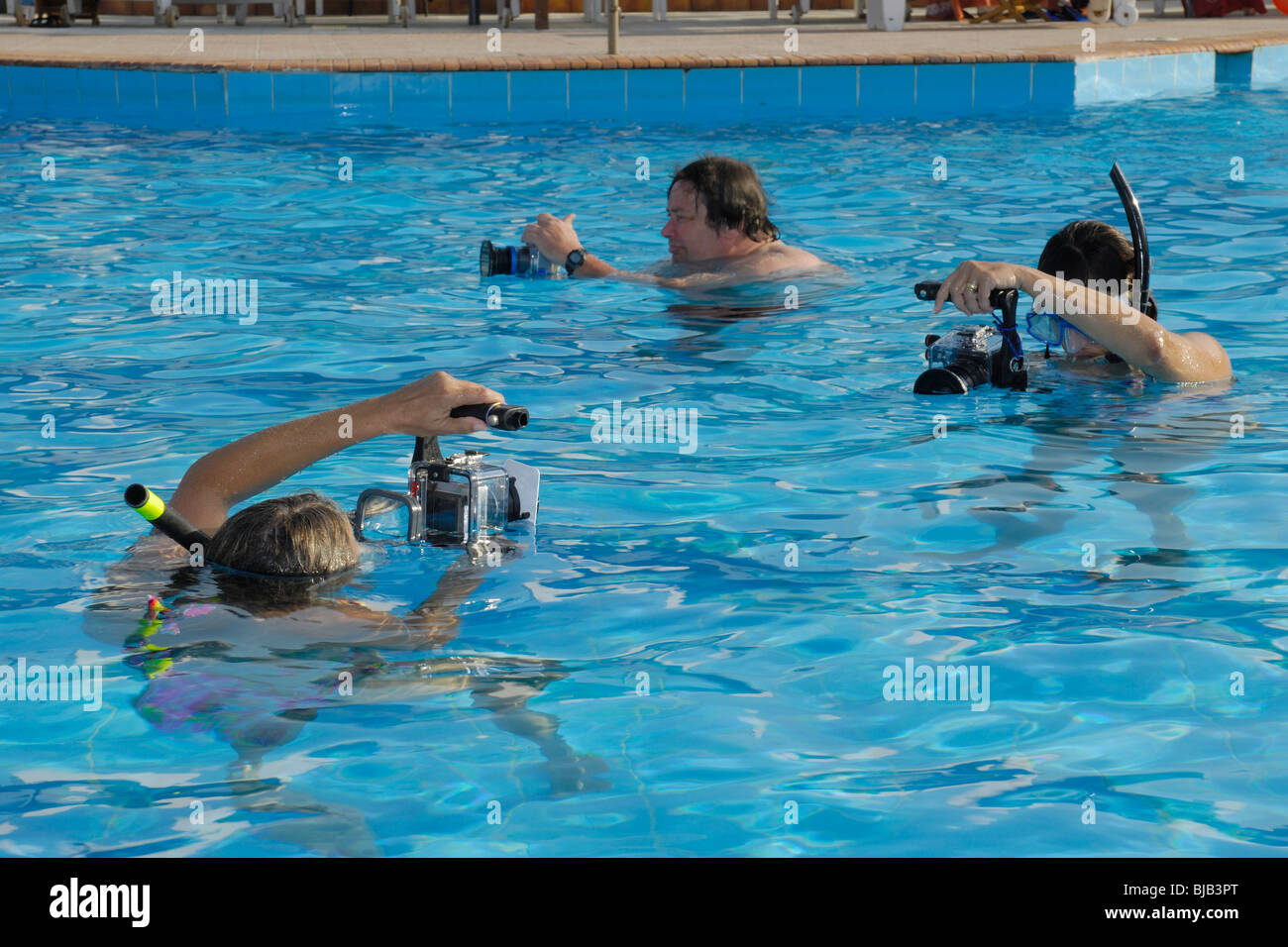 Divers learning how to shoot an over under picture Stock Photo - Alamy