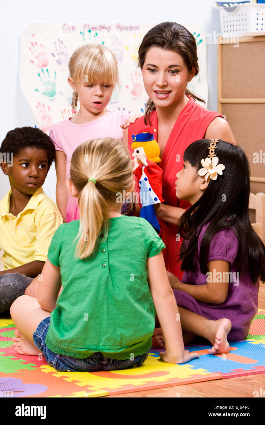Teacher preschool children playing puppets hi-res stock photography and ...