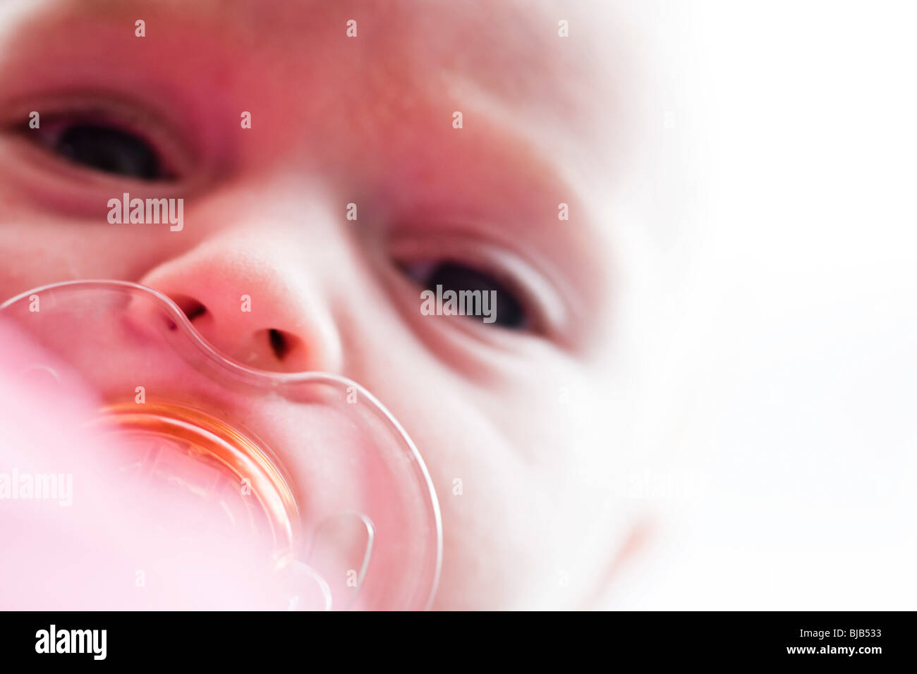 Face of one month old baby with pacifier Stock Photo - Alamy