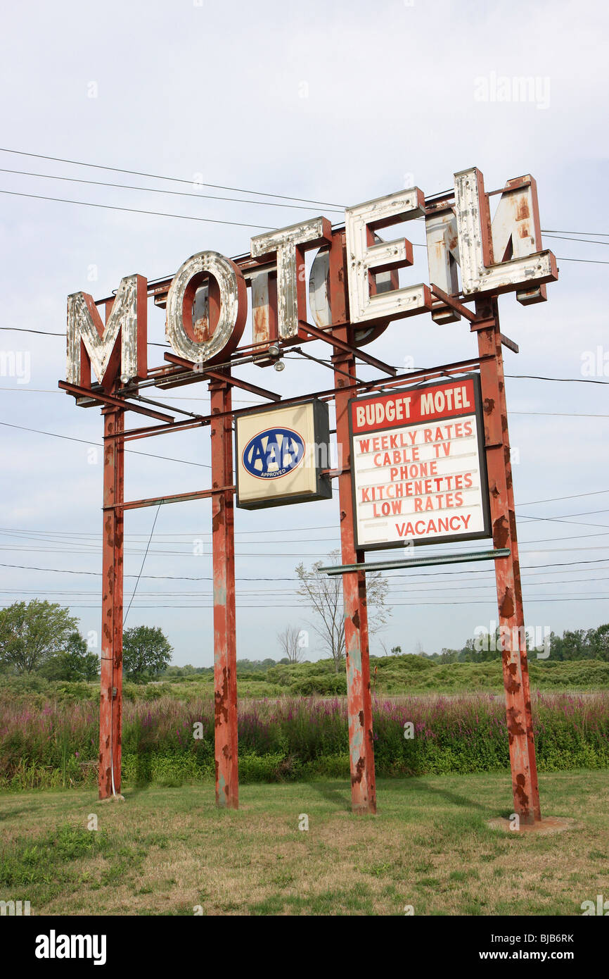 An old, rusted billboard advertising a motel, Grand Island, United ...