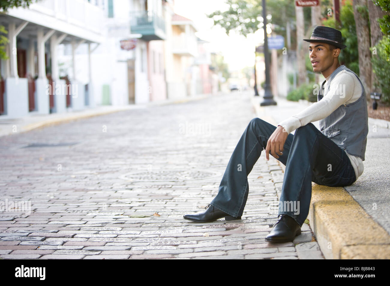 Man Sitting On Curb High Resolution Stock Photography and Images - Alamy