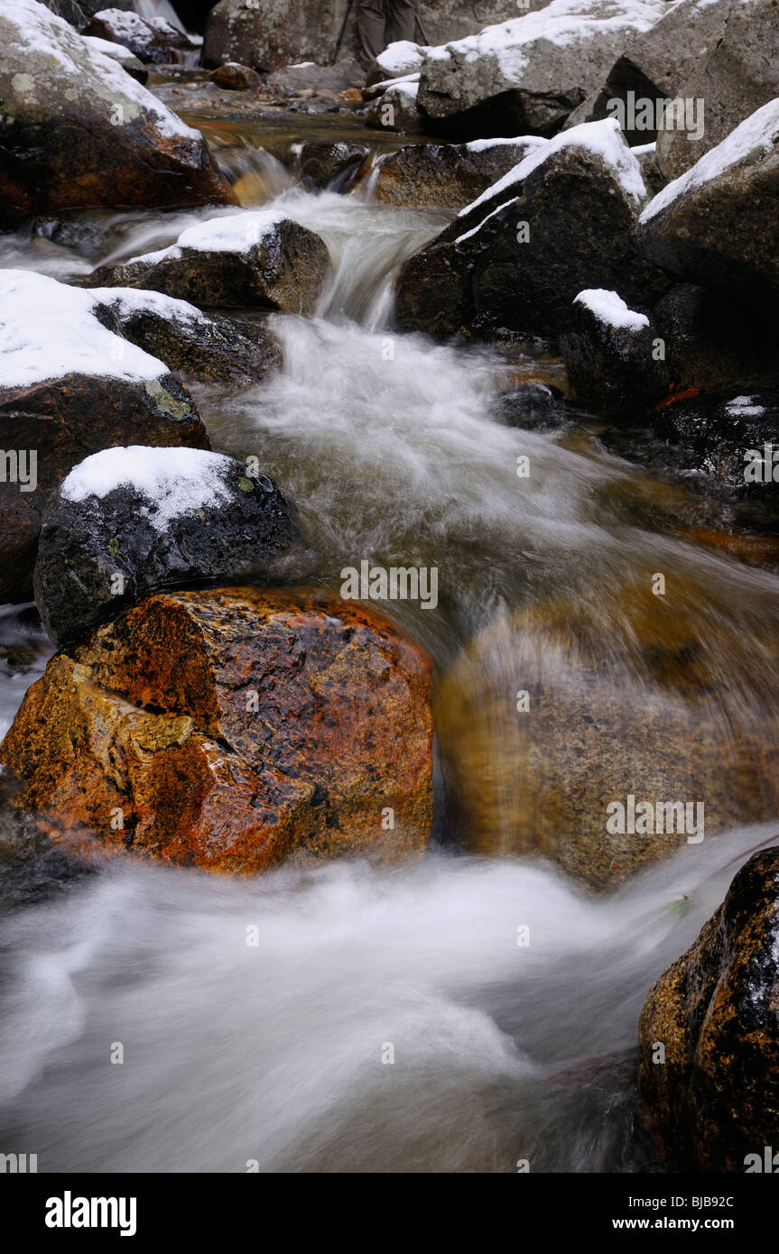 Cold waterfall with snow on rocks on Bridalveil Creek below the Fall in ...