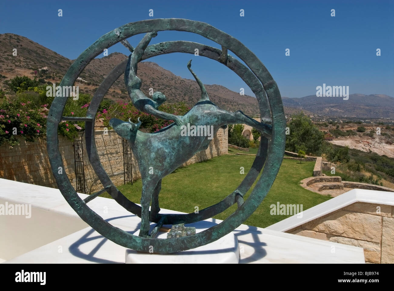 Decorative rustic garden sculpture on terrace of luxury Greek villa ...