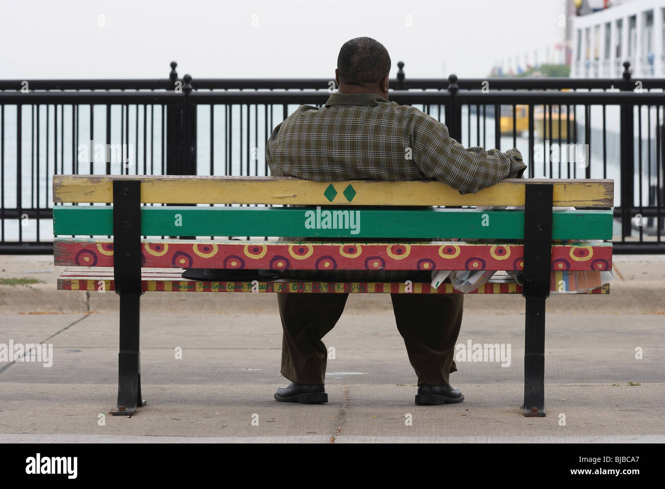 Fat Man Sitting On Bench Stock Photos & Fat Man Sitting On Bench Stock ...