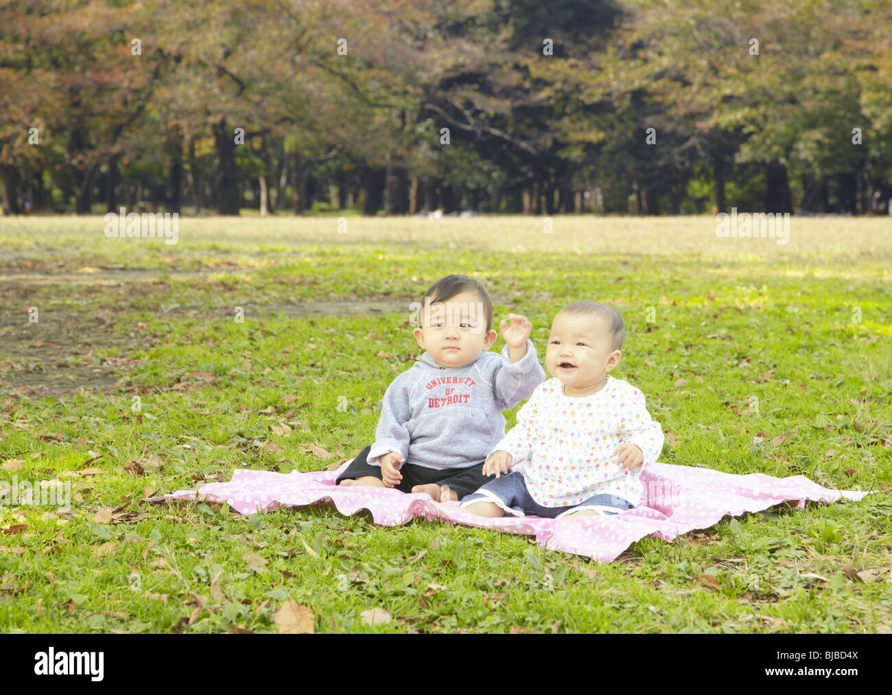 Baby in park Stock Photo - Alamy