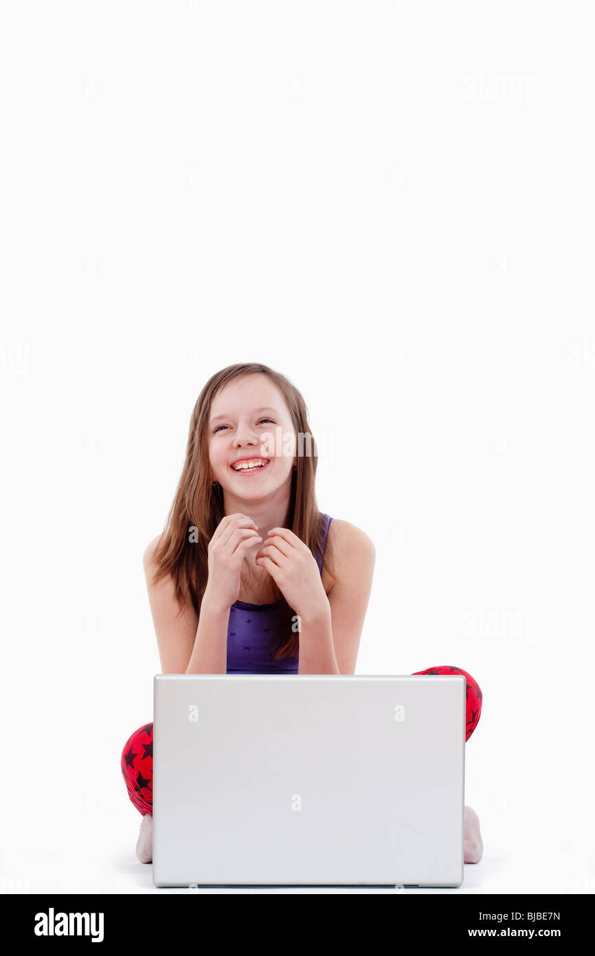 young girl with laptop computer smiling - isolated on white Stock Photo ...