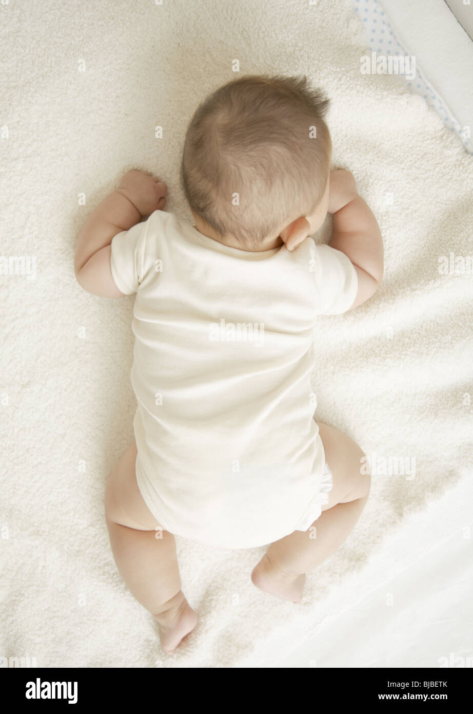 Lying baby face down Stock Photo - Alamy