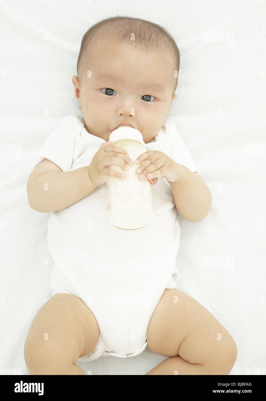 Baby drinking milk Stock Photo - Alamy