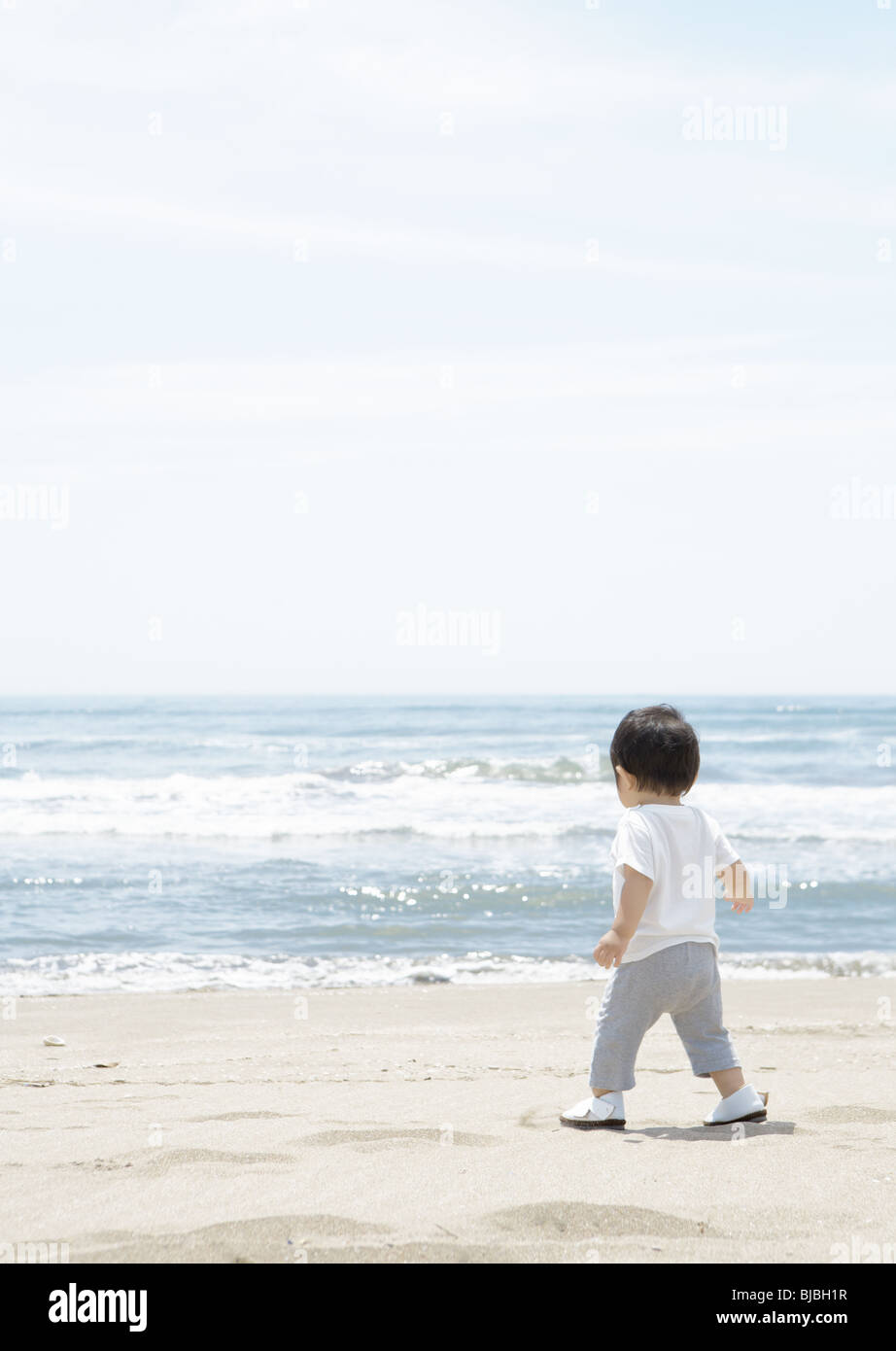 Boy on beach Stock Photo - Alamy