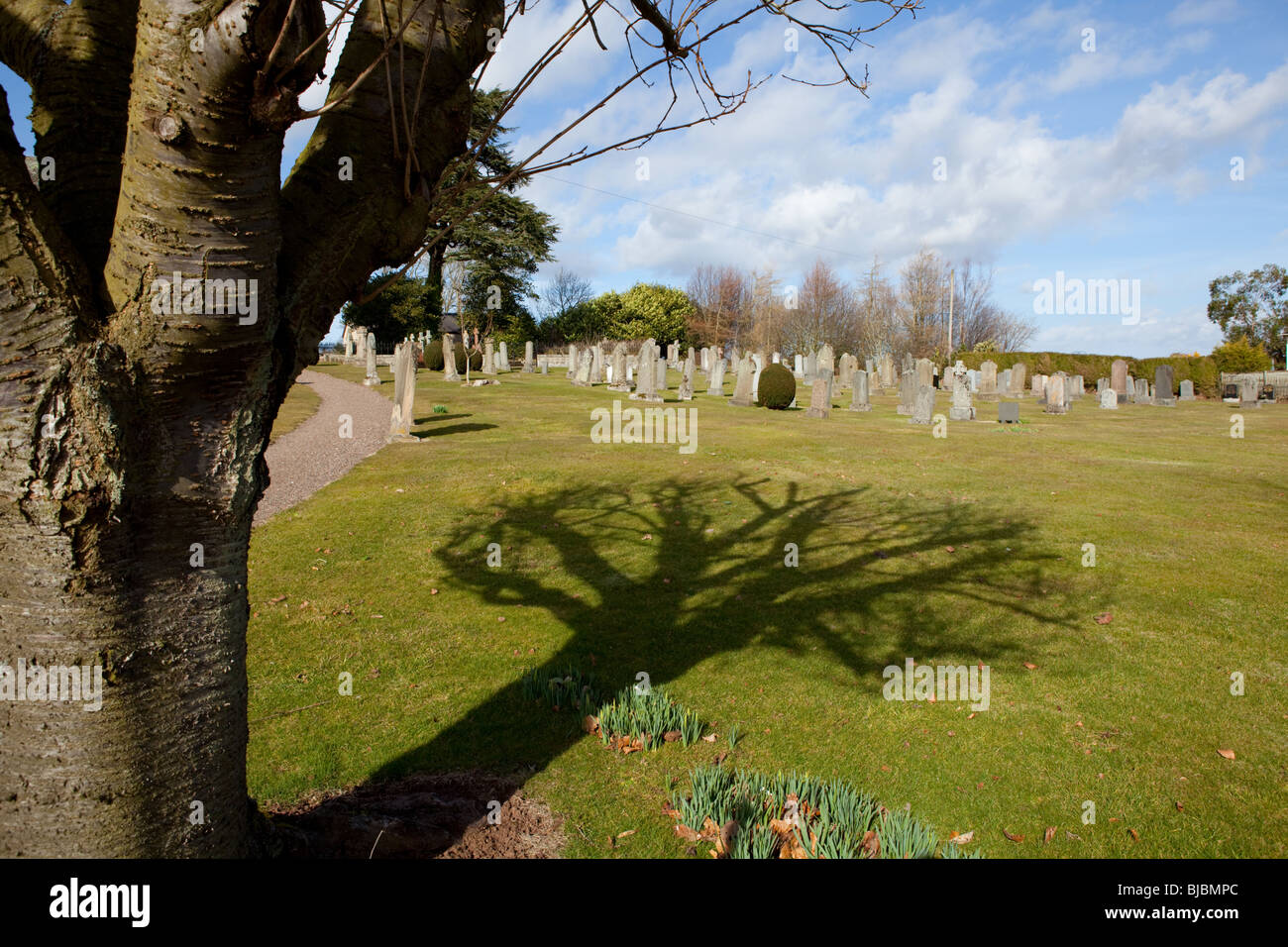The shadow of a tree at a rural country church at Gavinton, Scottish ...