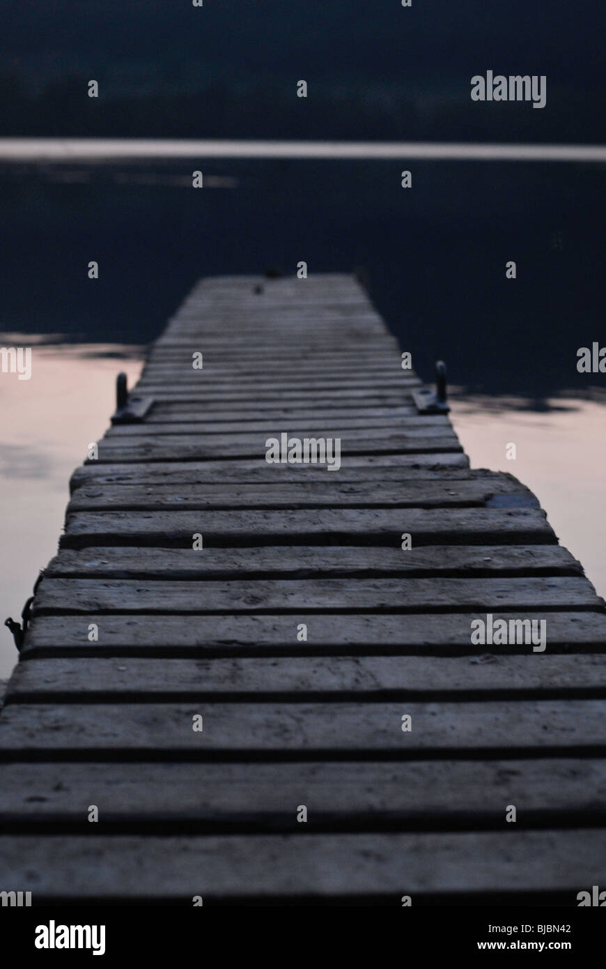 A walkway onto a lake Stock Photo - Alamy