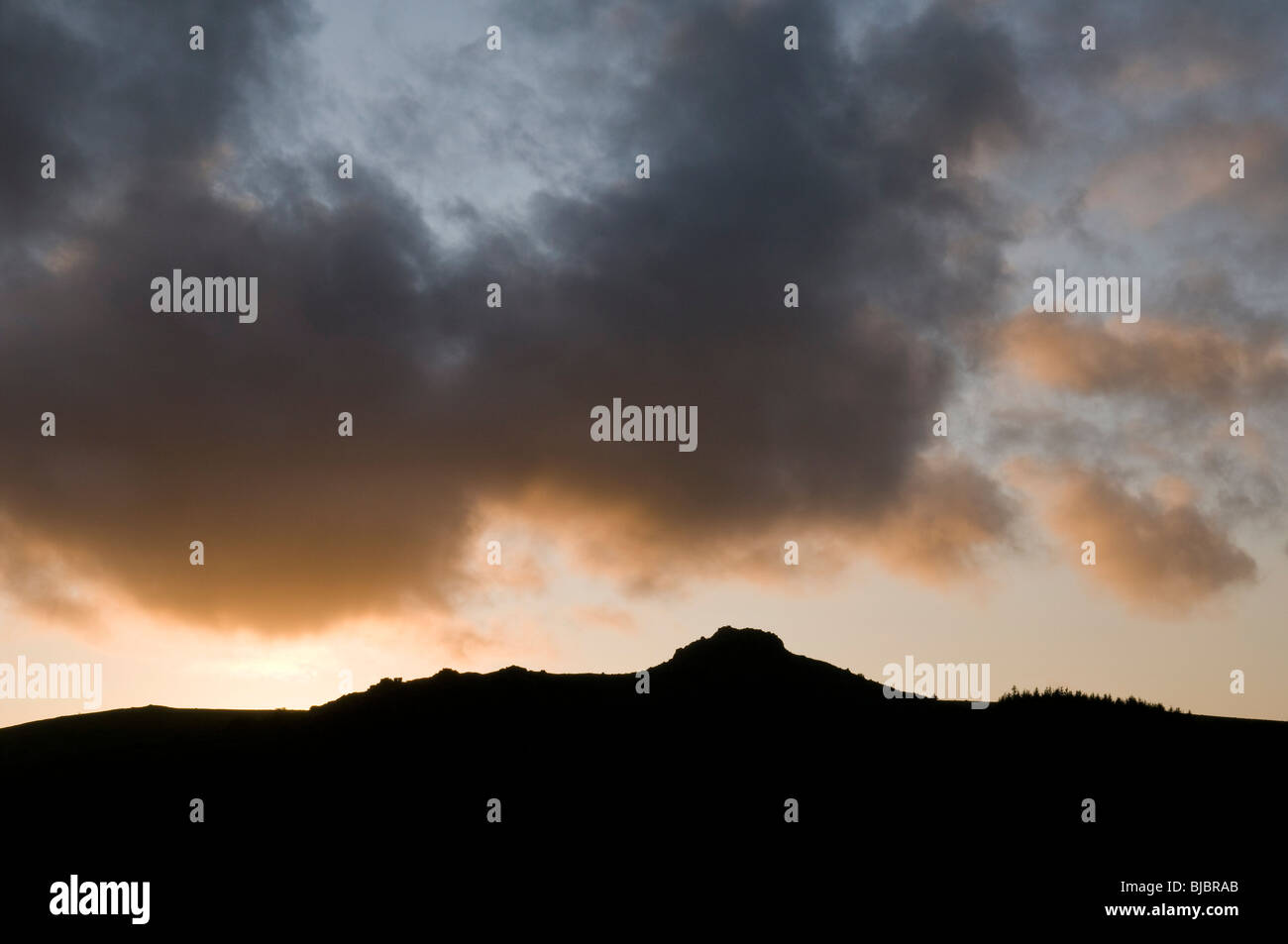 Angry dark clouds at sunset above rocky Dartmoor skyline, Devon UK ...