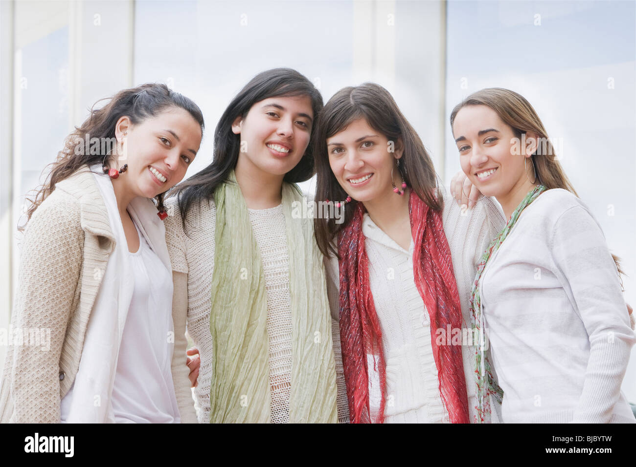 Hispanic women smiling Stock Photo - Alamy