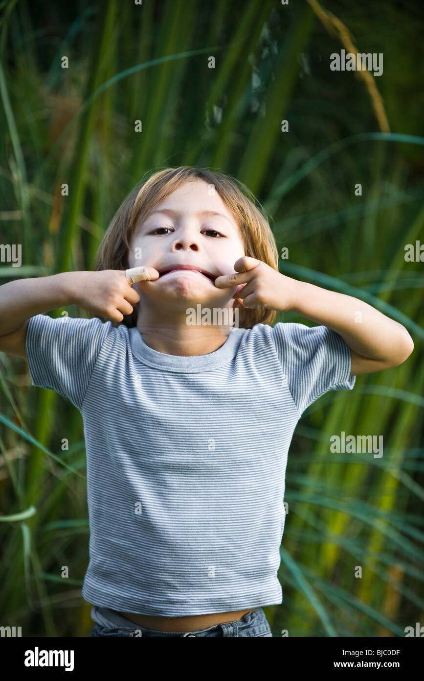 Little boy making faces, portrait Stock Photo - Alamy
