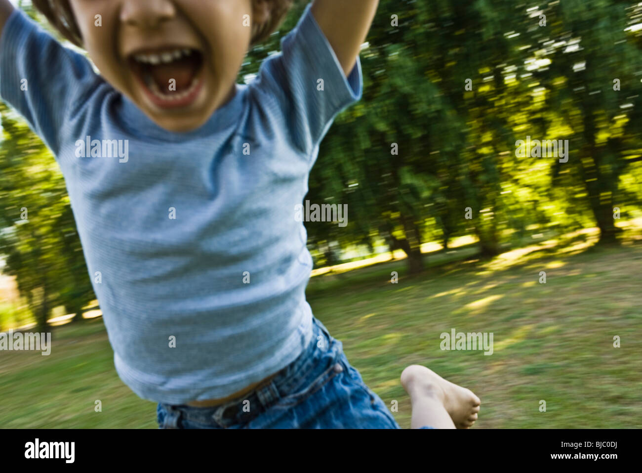 Little boy spinning, cropped Stock Photo - Alamy