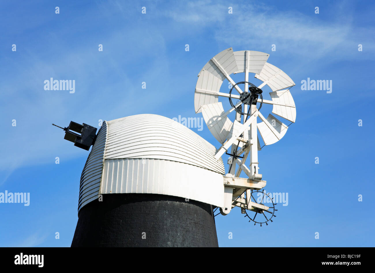 Detail of the cap of Runham North Drainage Mill against a blue sky at ...