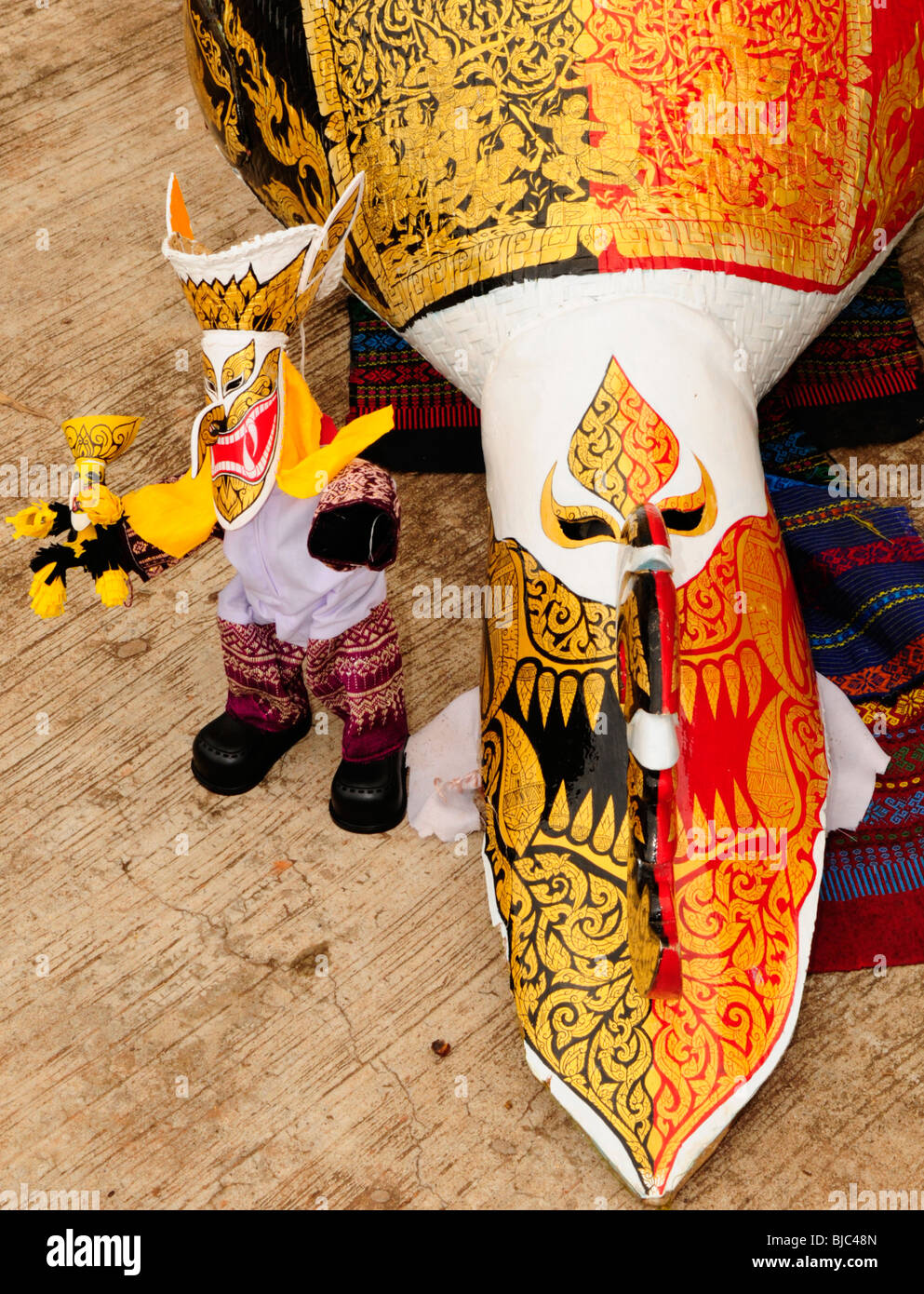 mask and ghost puppet holding ghost puppet , pee ta khon (the ghost ...