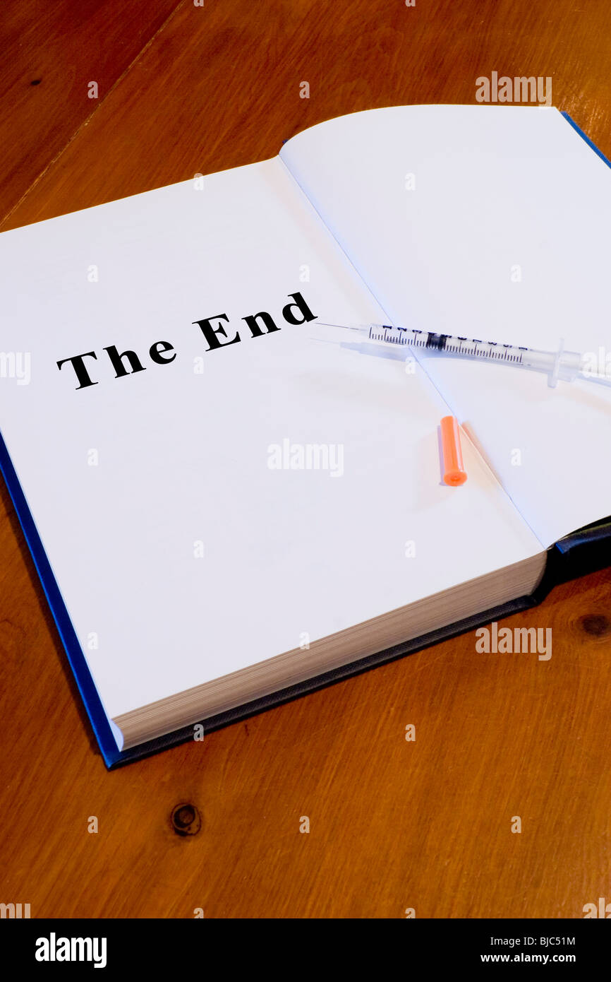 Book showing The End with a syringe Stock Photo - Alamy