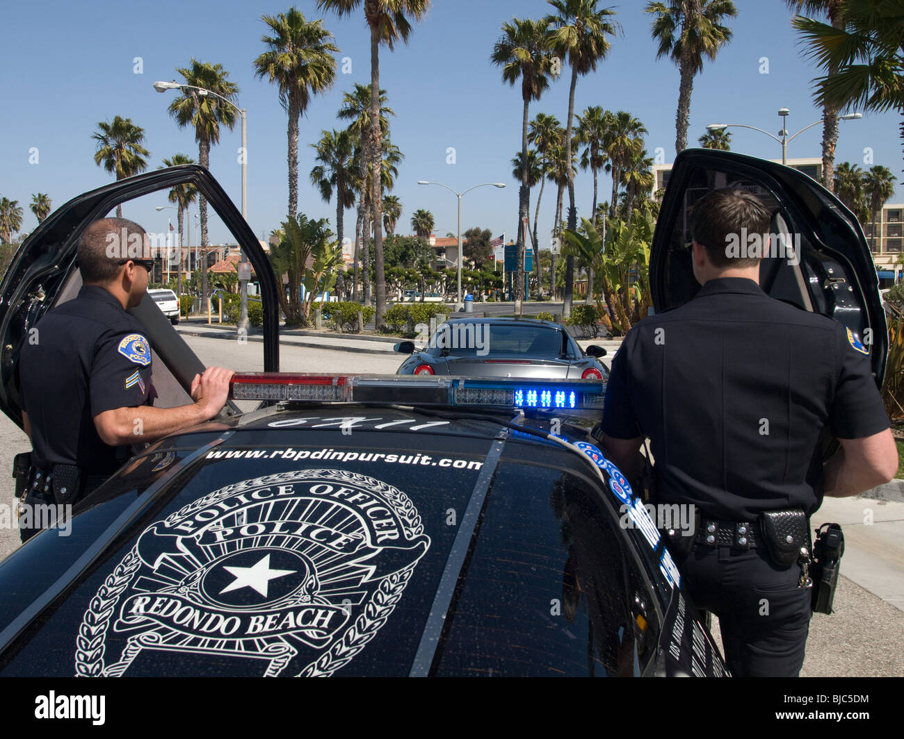 Two male police officers stop suspect Ferrari at DUI check Stock Photo ...