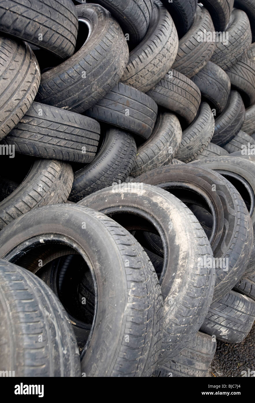 Waste car tyres stacked up in a pile waiting to be recycled Stock Photo ...