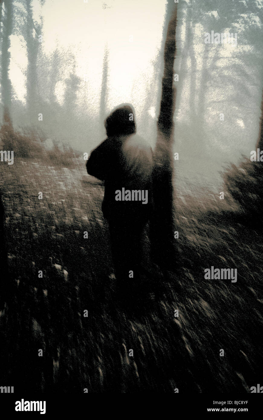 figure running through tress Stock Photo - Alamy
