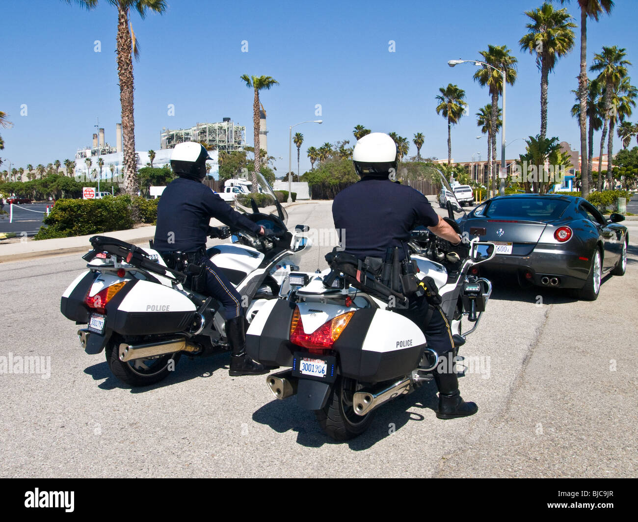 Two motor officers pull over suspect vechicle Stock Photo - Alamy